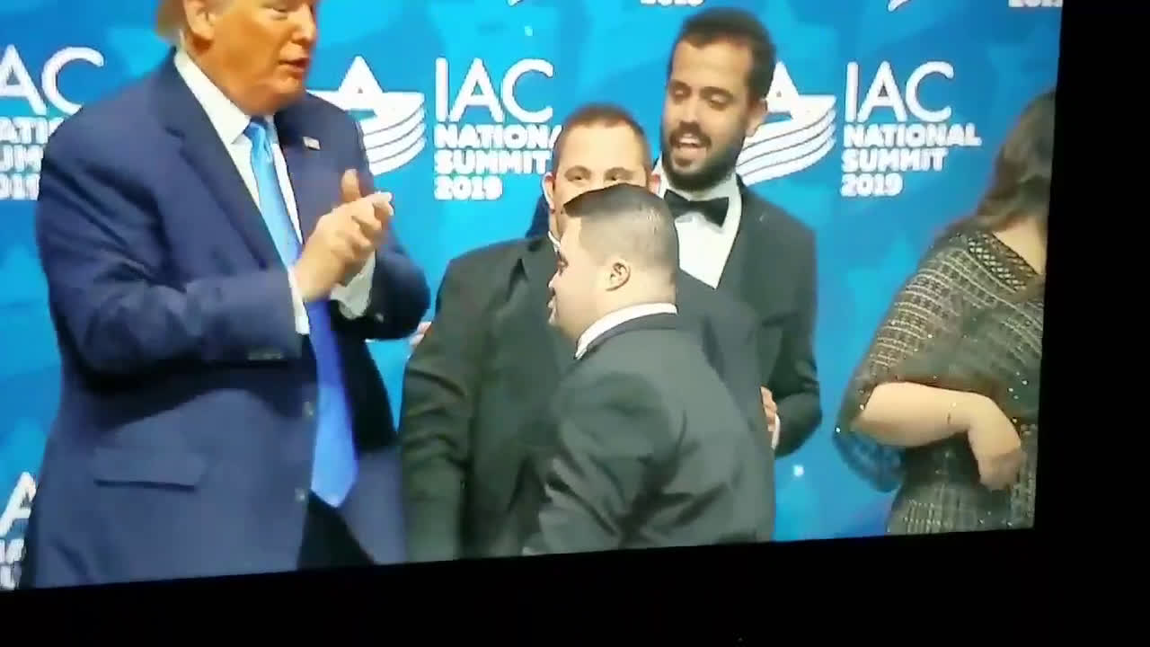 trump hugs disabled performers