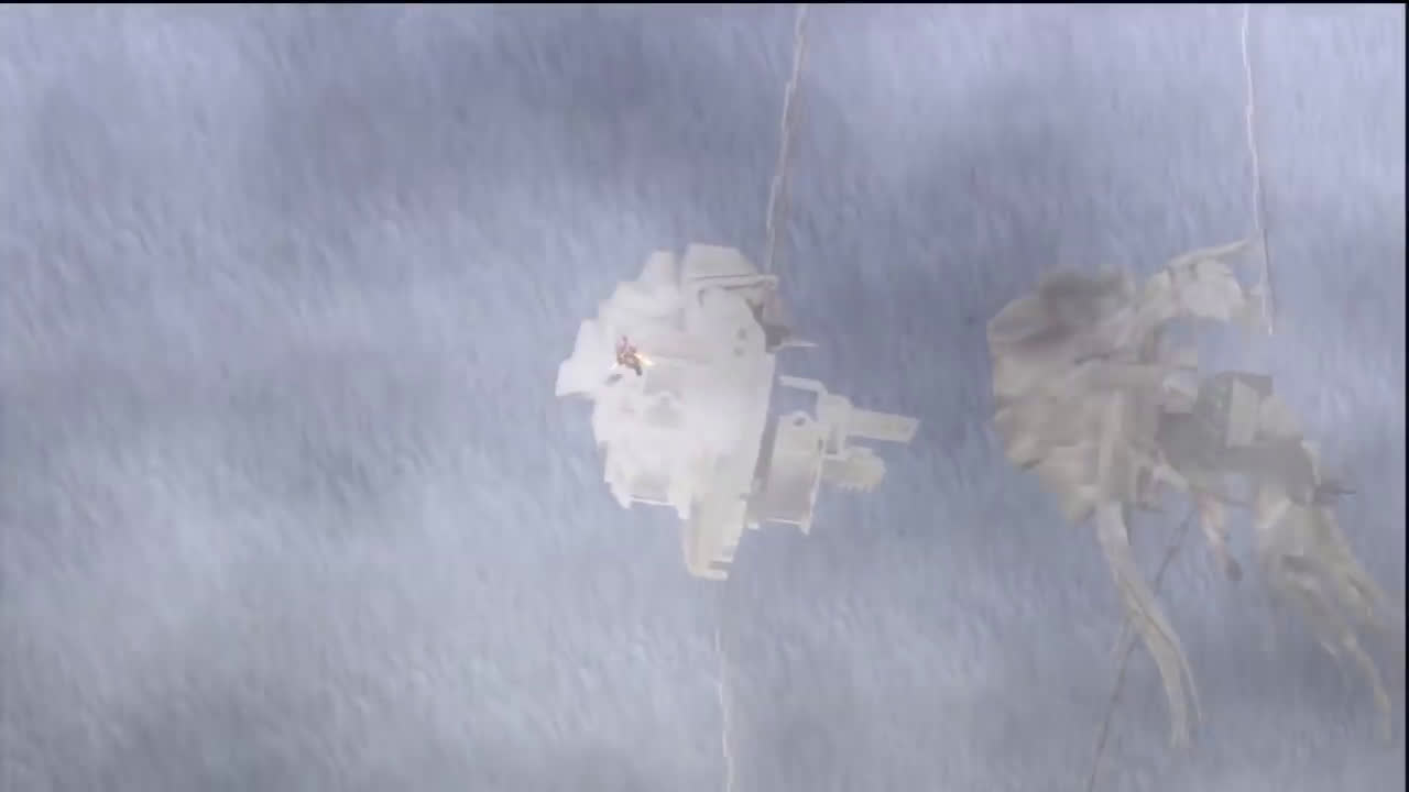 Kratos stops his fall with the Blades of Chaos