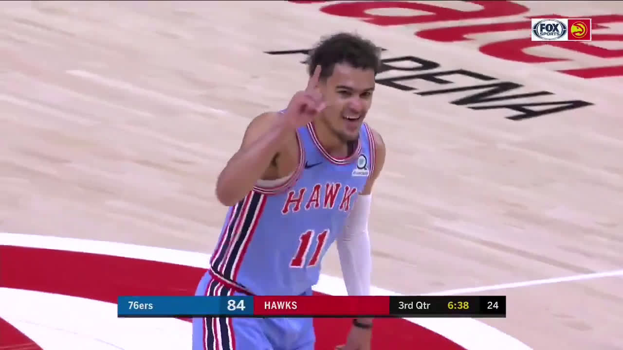 Trae Young throws the lob to John Collins who slams home the reverse dunk