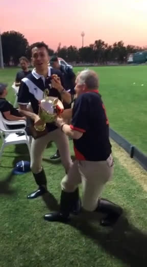 Alex Albon and Johnny Herbert squabble over a camel polo trophy