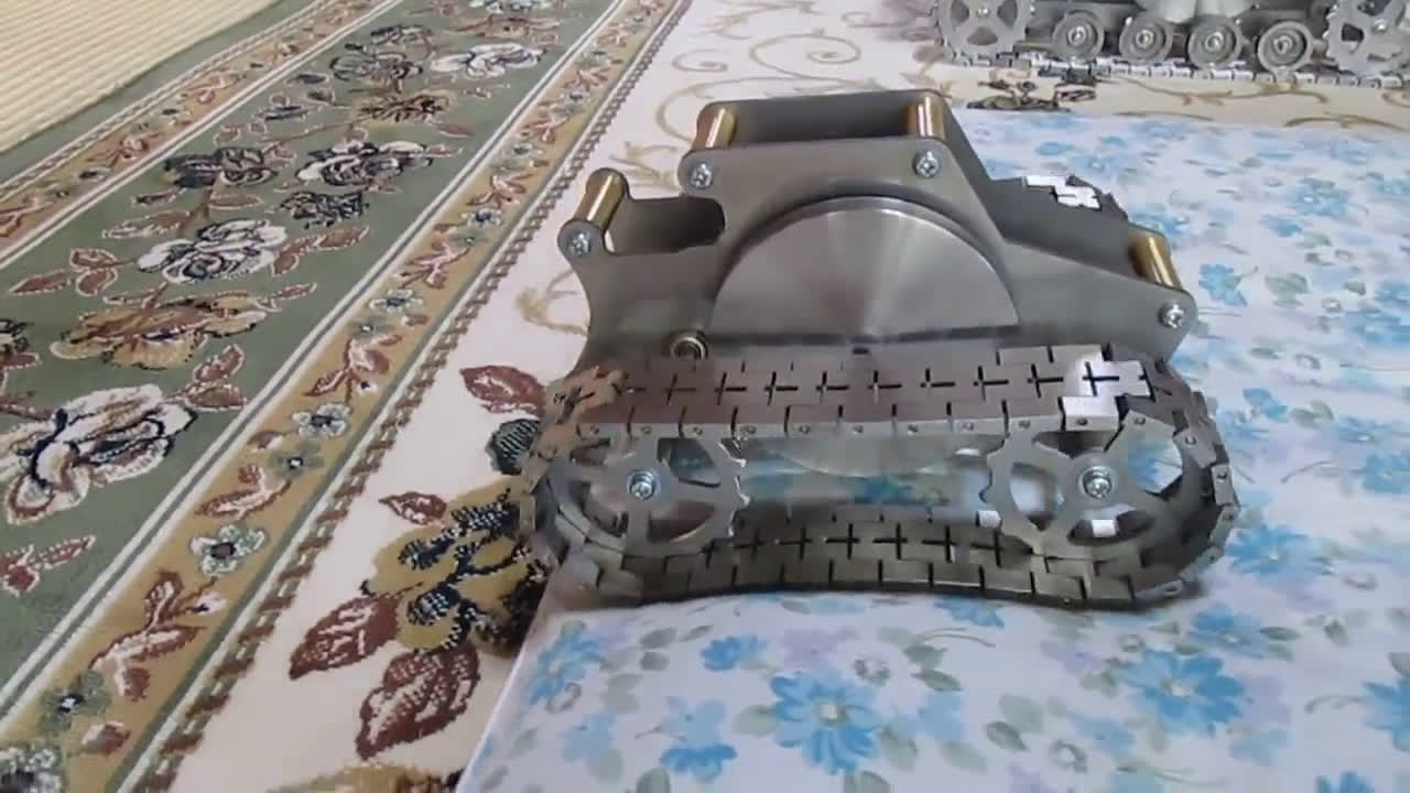 A toy tank powered by rotational energy stored in a flywheel