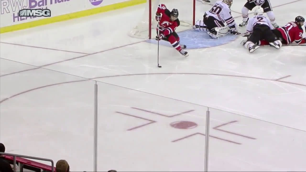 Hall picks up a loose puck in front of a wide open net and shoots it wide