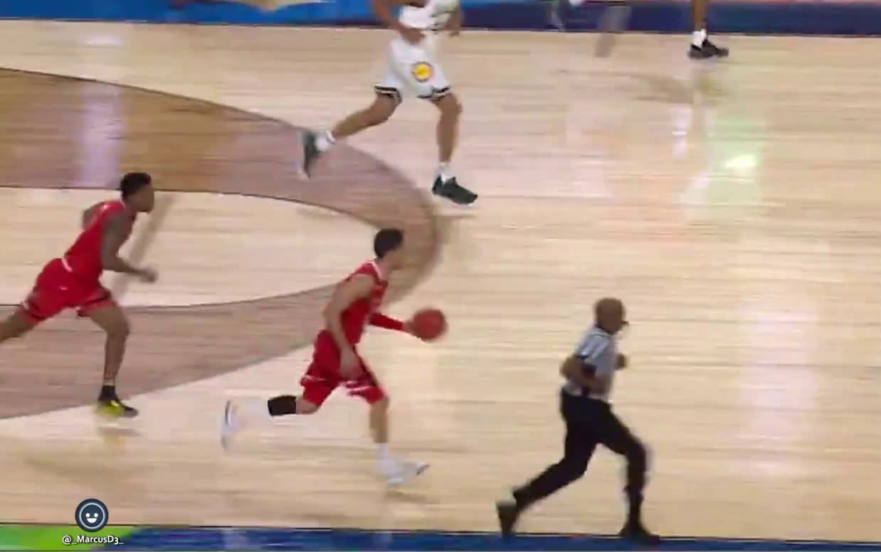 Referee running, high stepping in final 4 game Texas Tech vs Michigan State.