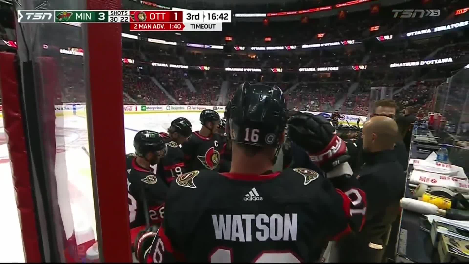 [OTT-MIN] Austin Watson making sure the camera behind the bench doesn't see the Sens timeout play