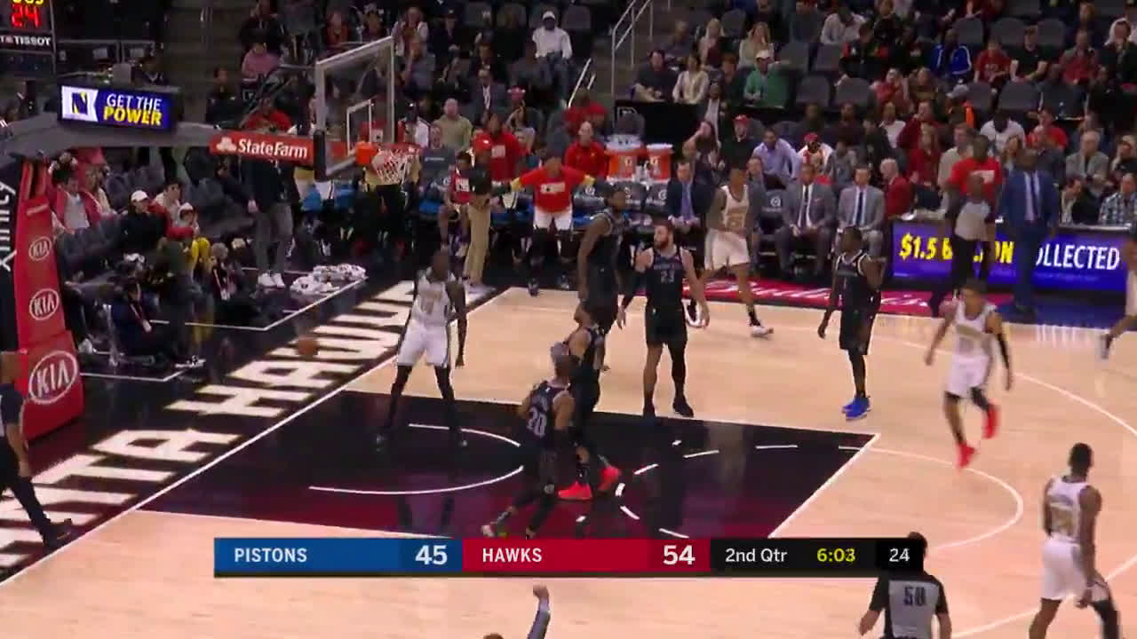 Trae Young dribbles through his legs and delivers a bounce pass to a ...