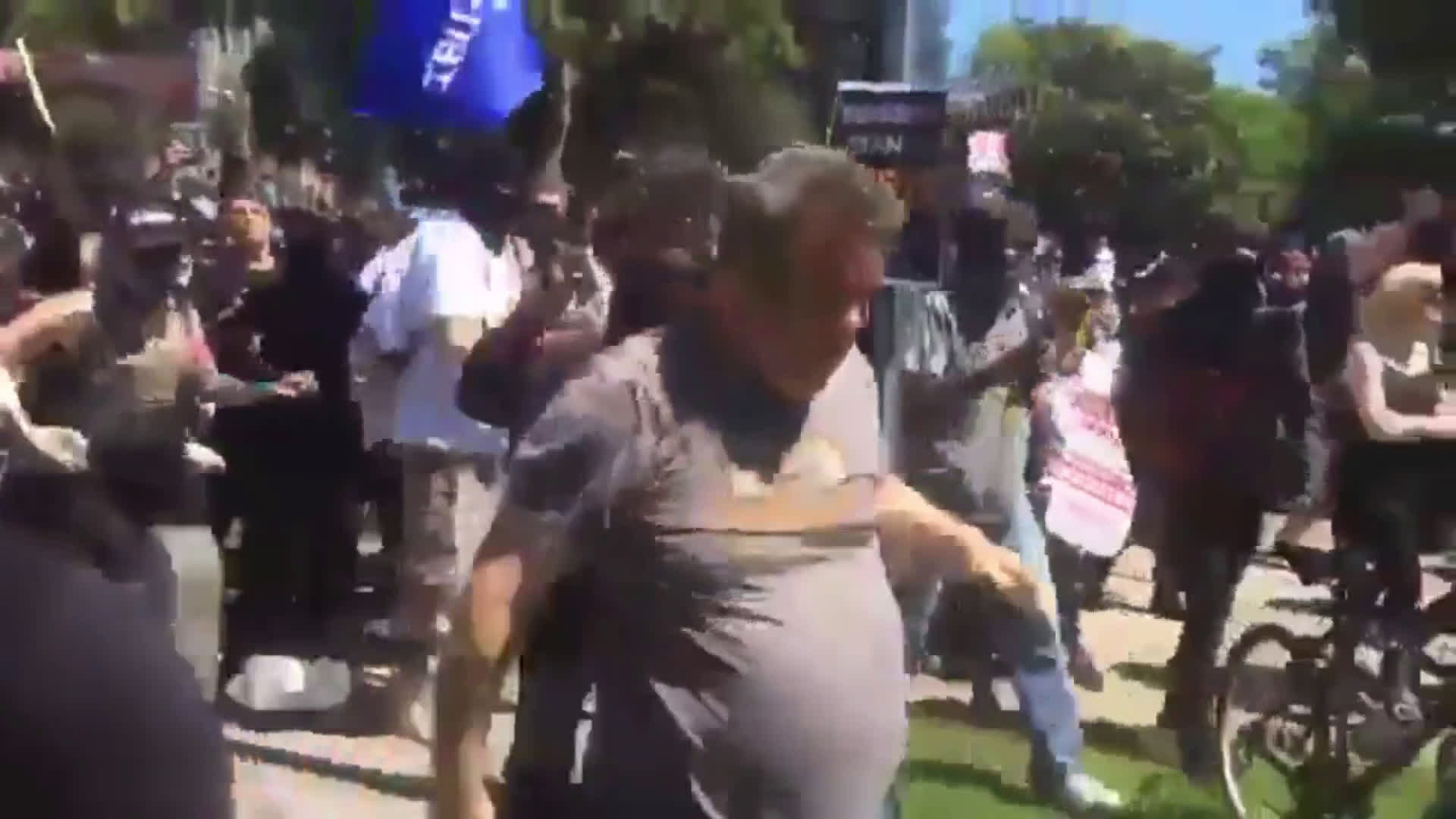 Berkeley AntiFA terrorists beat innocent man with shield dump urine on him