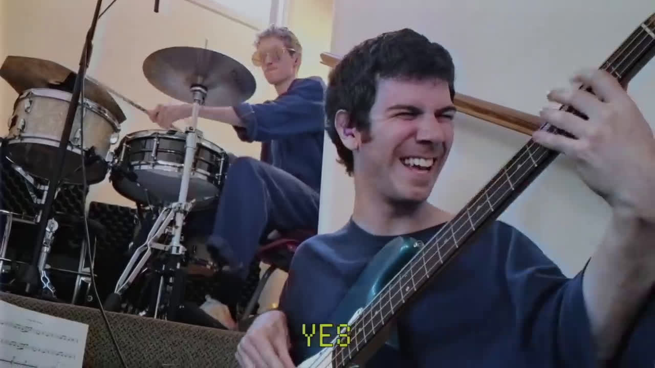 Dorky guy makes music in his hallway