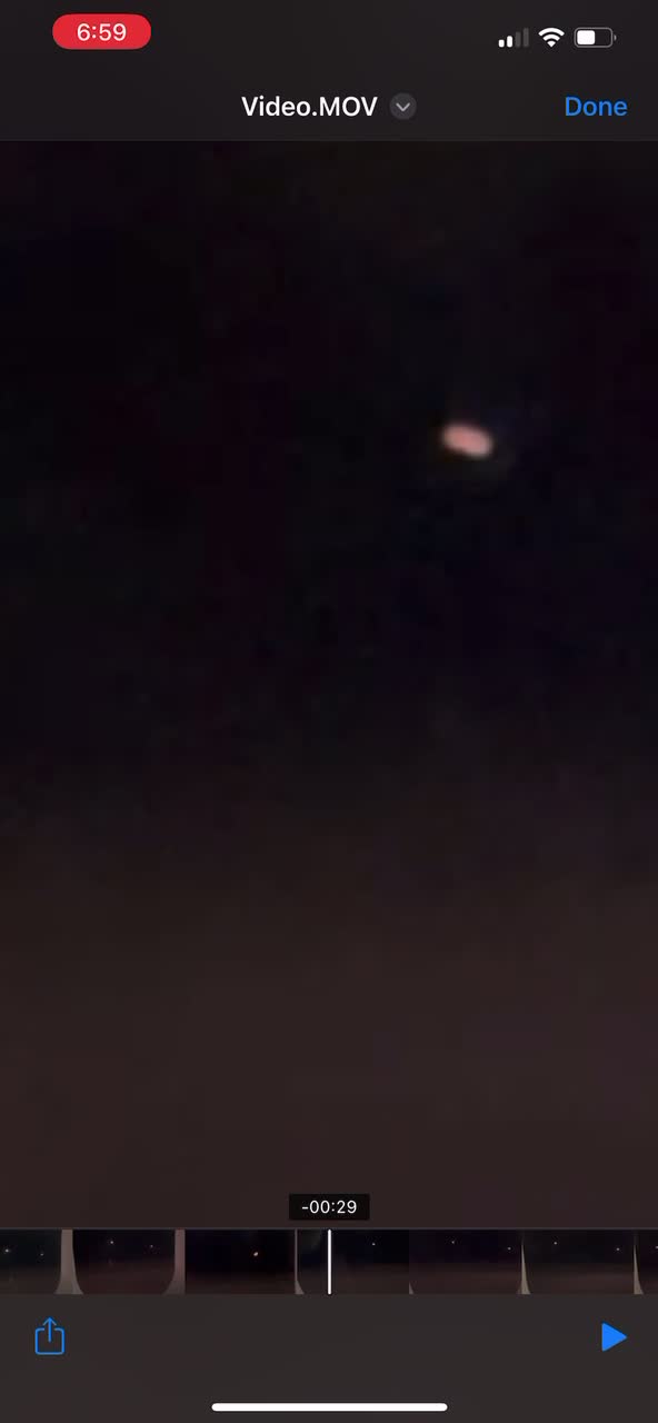 Orange orb UAP changing shape?