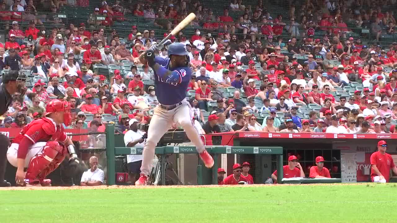 Adolis Garcia takes a walk, accompanied with a bat flip.