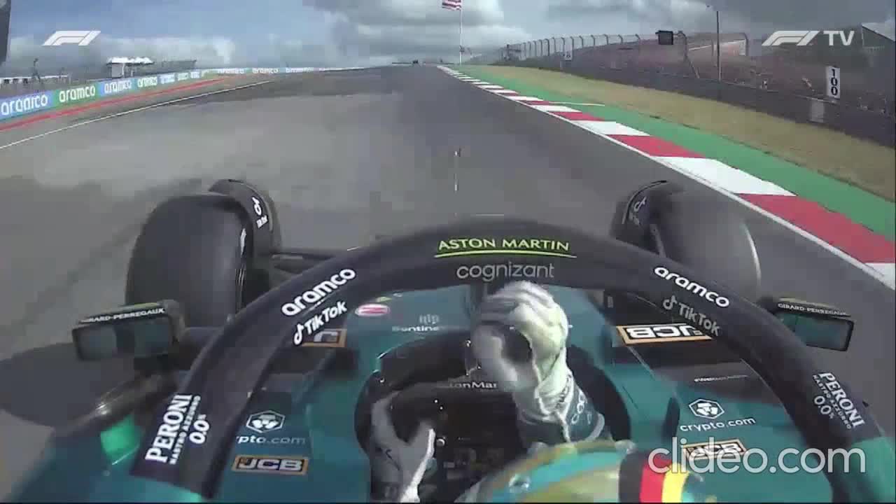Tim Cook waving flag when Vettel passes finishing line