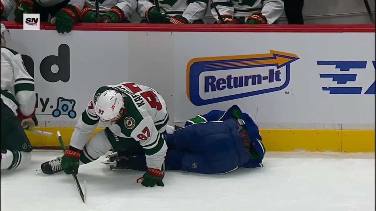 Burroughs gets hit into the boards awkwardly