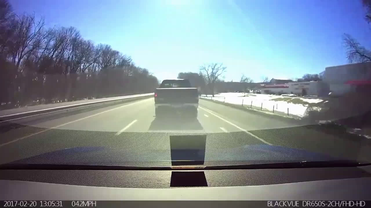 Sloth merges in from shoulder while on phone.